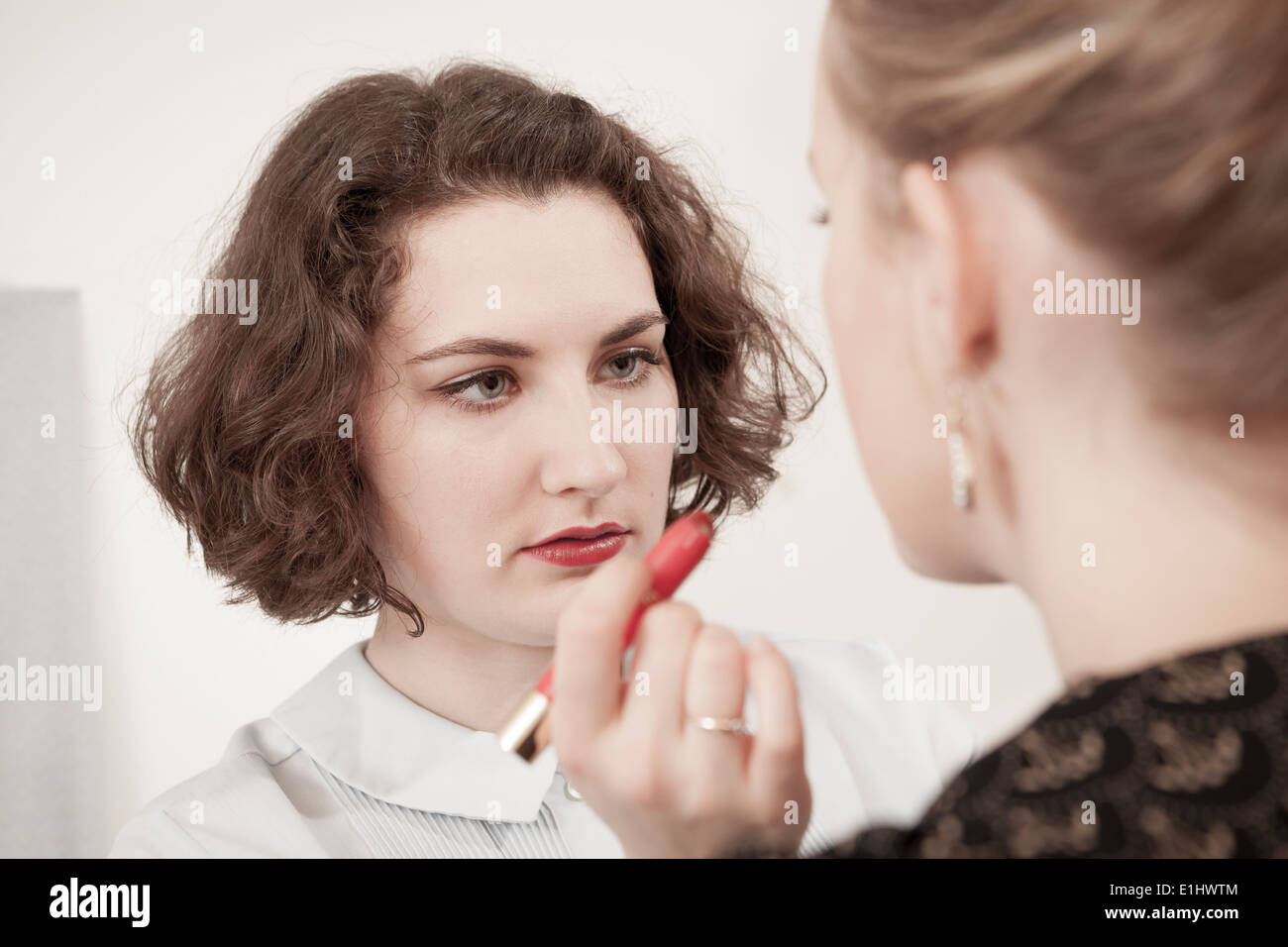 Woman applying lipstick vintage hi-res stock photography and images - Alamy