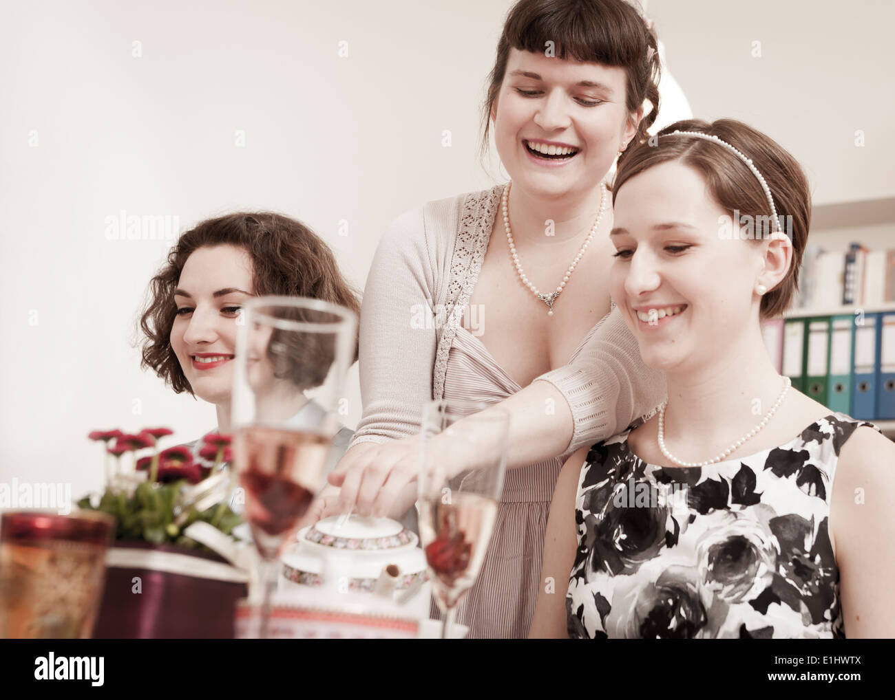 Young women on a retro style tea party Stock Photo - Alamy