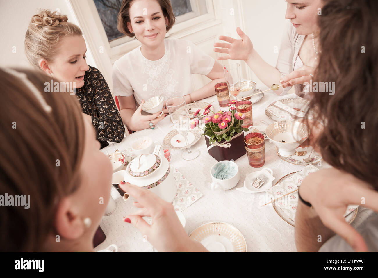 Young women on a retro style tea party Stock Photo - Alamy