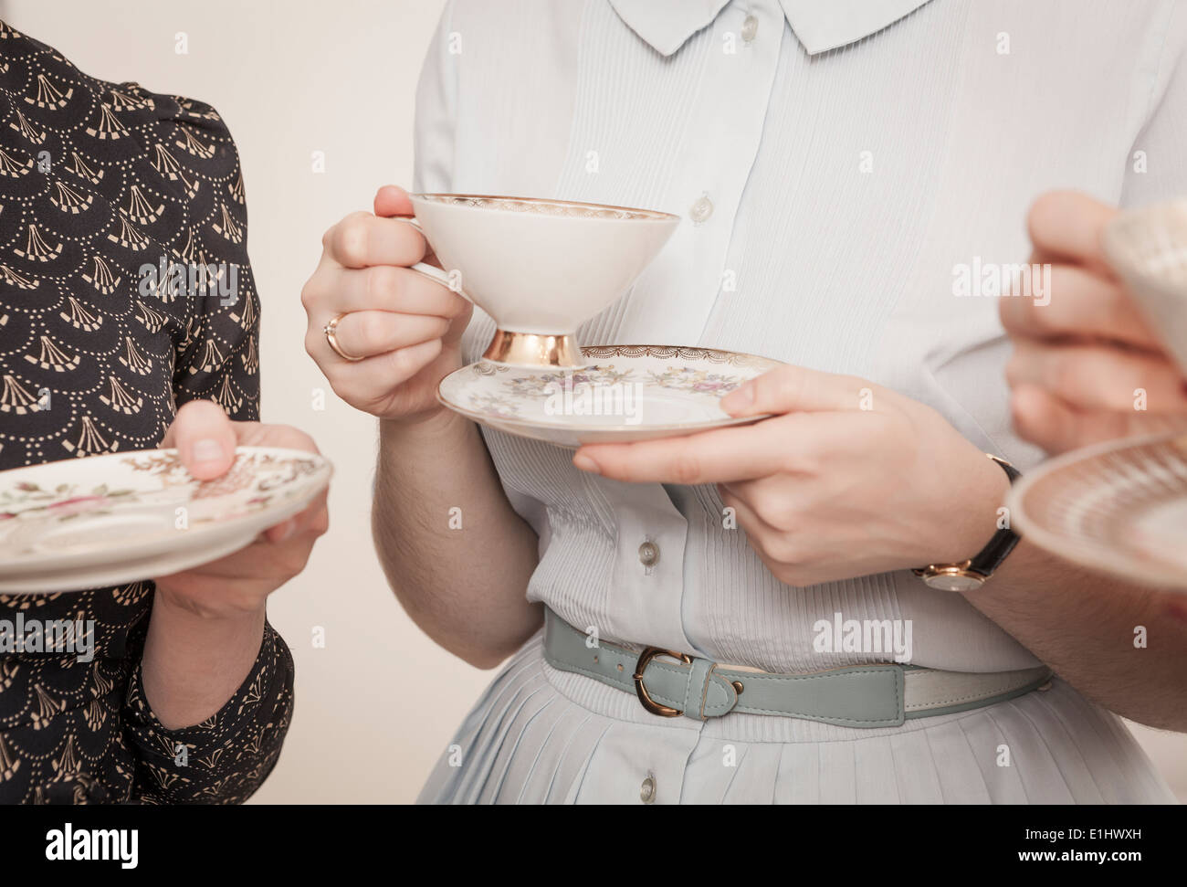 Young women on a retro style tea party, close-up Stock Photo - Alamy