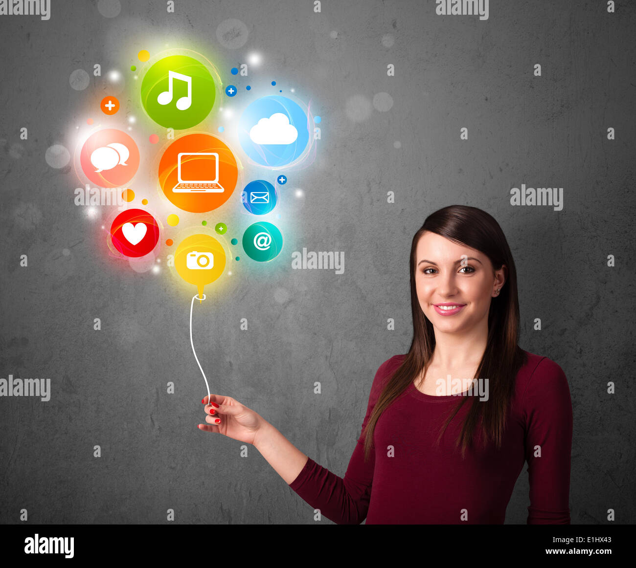 Woman holding social media balloon Stock Photo - Alamy