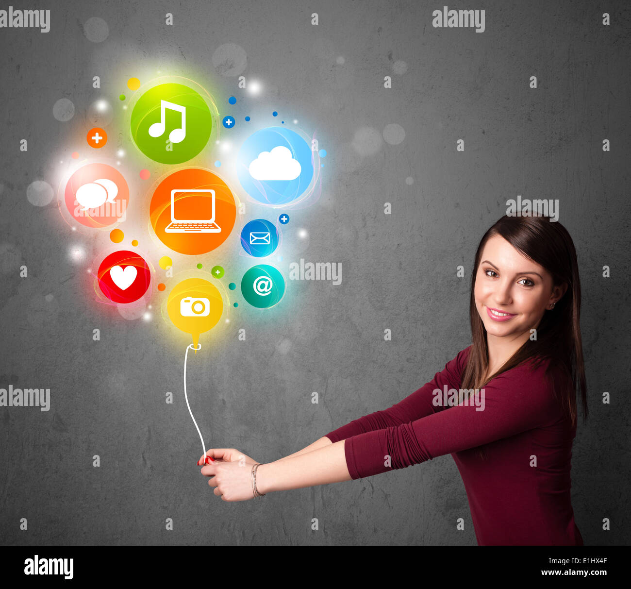 Woman holding social media balloon Stock Photo - Alamy