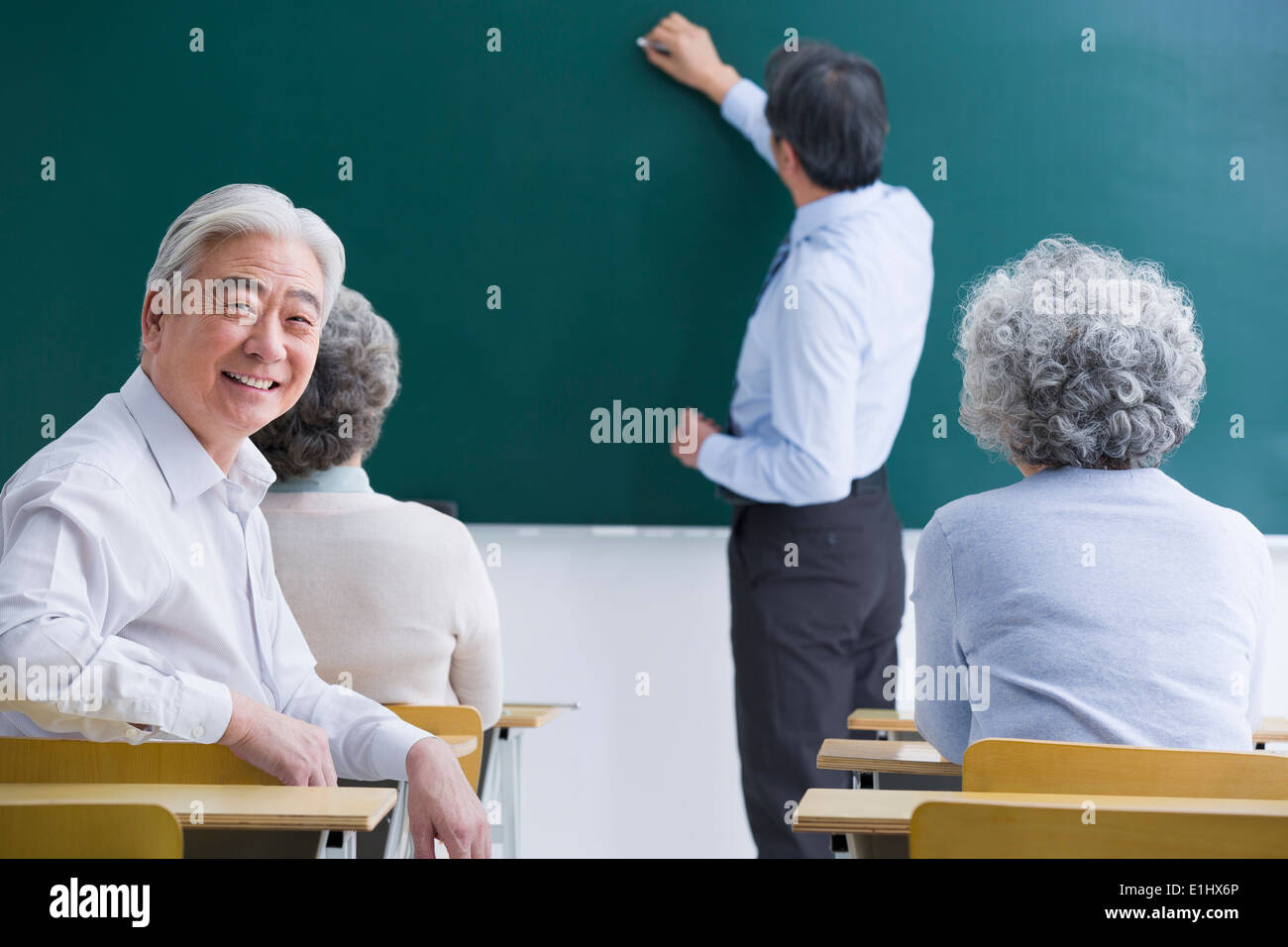 Senior adults having class at school Stock Photo - Alamy