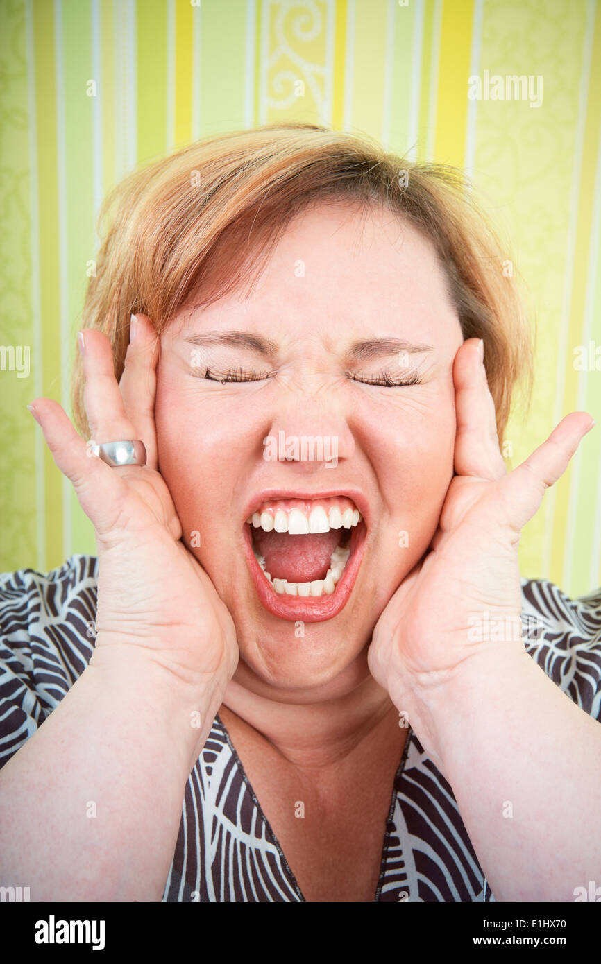 Germany, Mid-adult woman screaming Stock Photo - Alamy