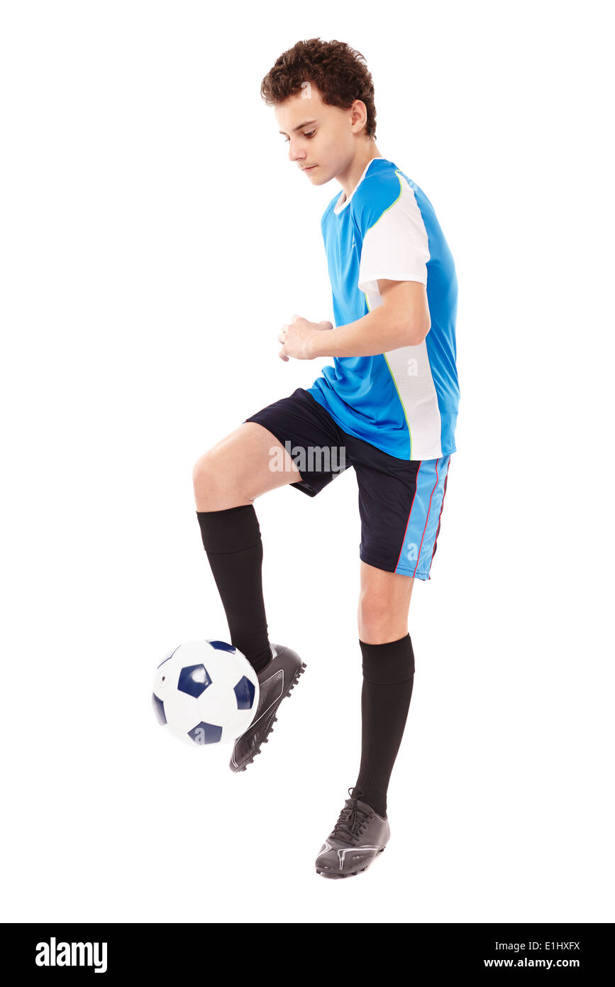Teenager boy soccer player kicking the ball isolated on white ...