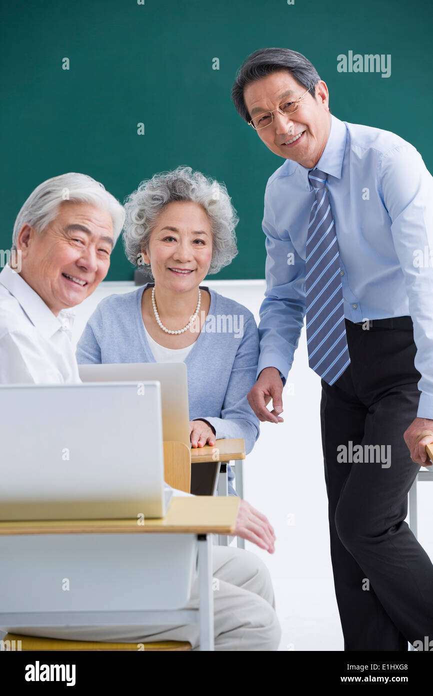 Senior adults having computer class at school Stock Photo - Alamy