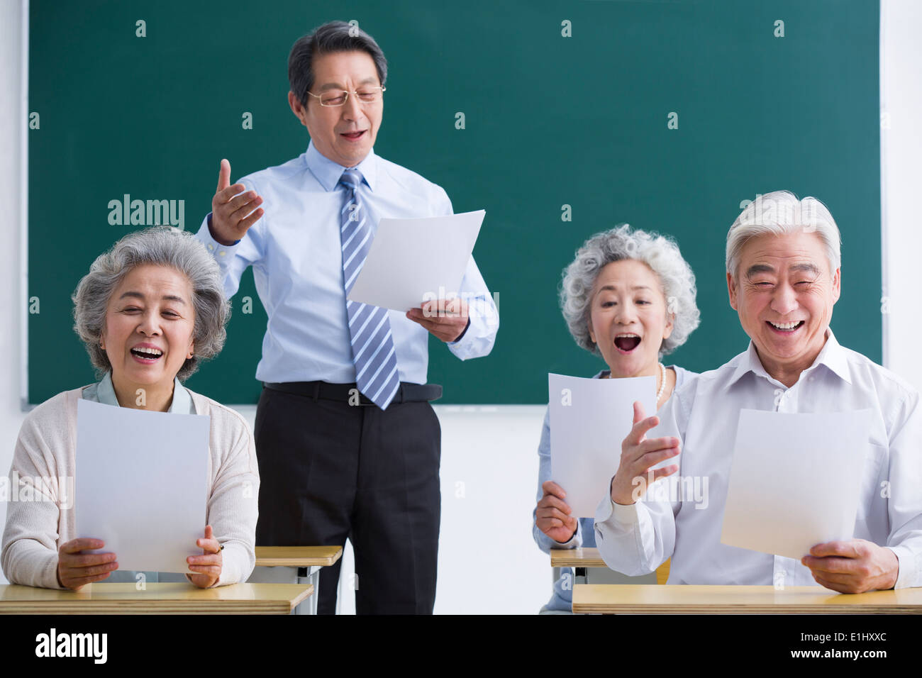 Senior adults having music class at school Stock Photo - Alamy