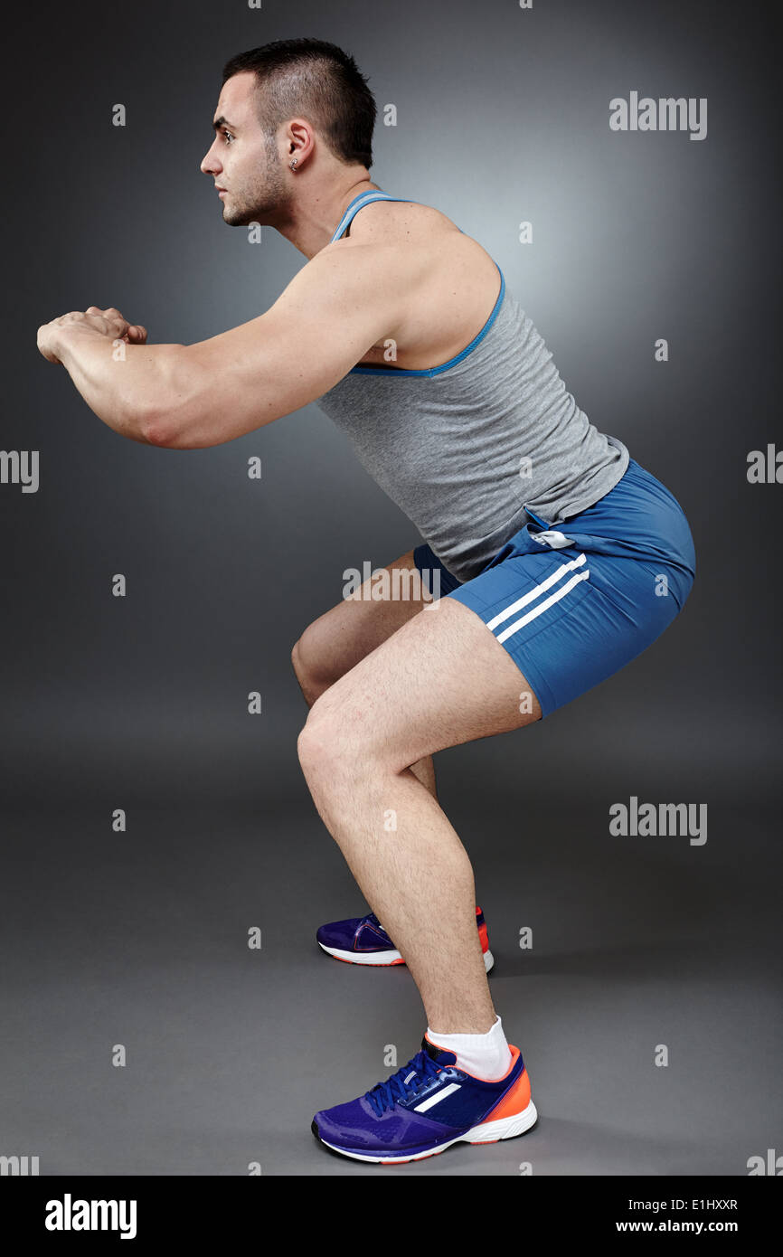 Full body man squat hi-res stock photography and images - Alamy
