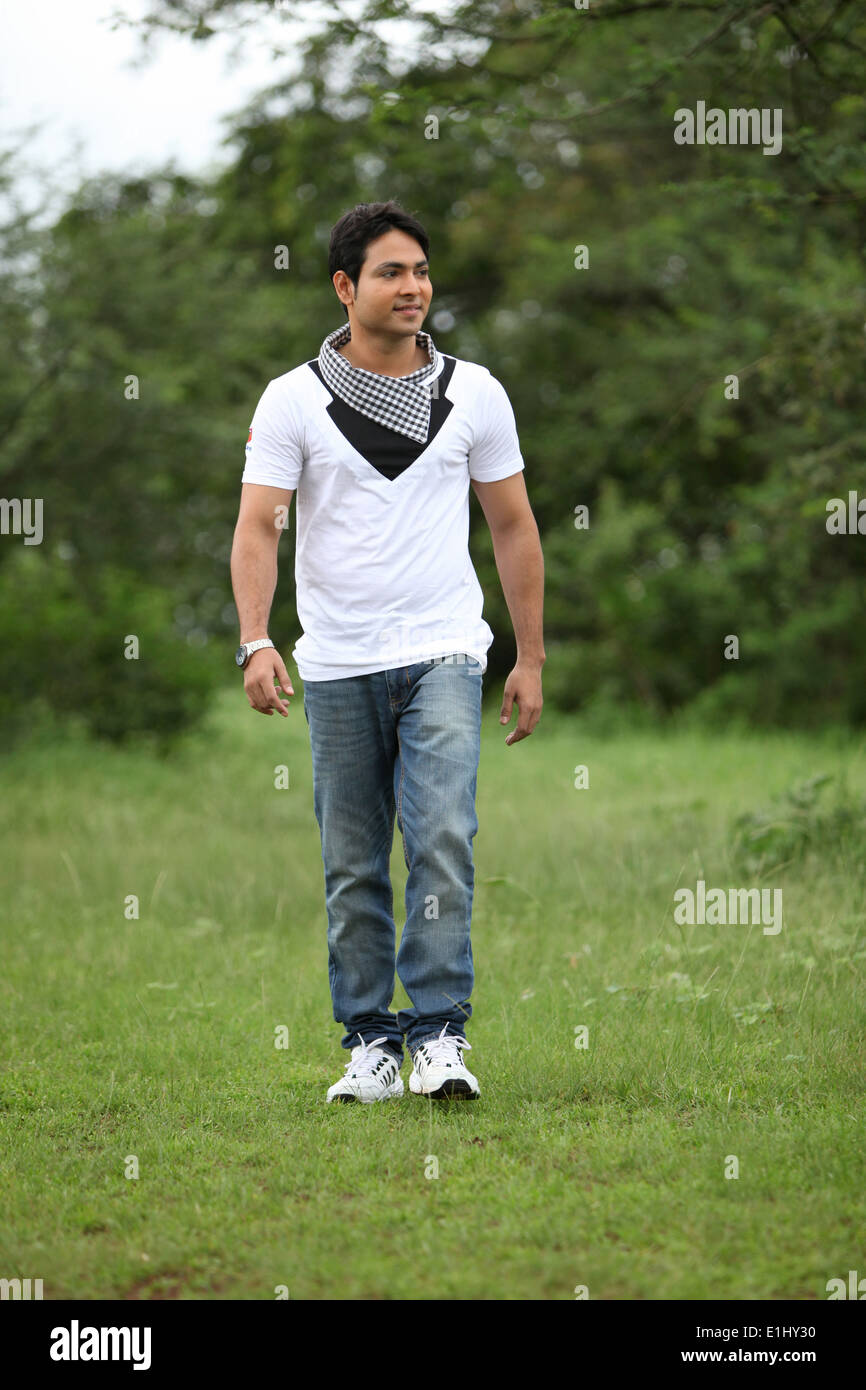 Young man walking in park Pune, India Stock Photo - Alamy