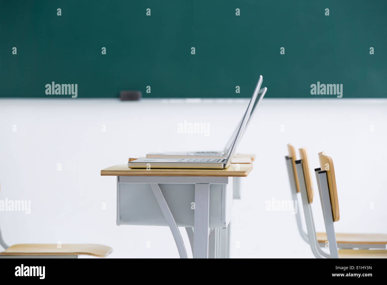 Laptops in classroom Stock Photo - Alamy