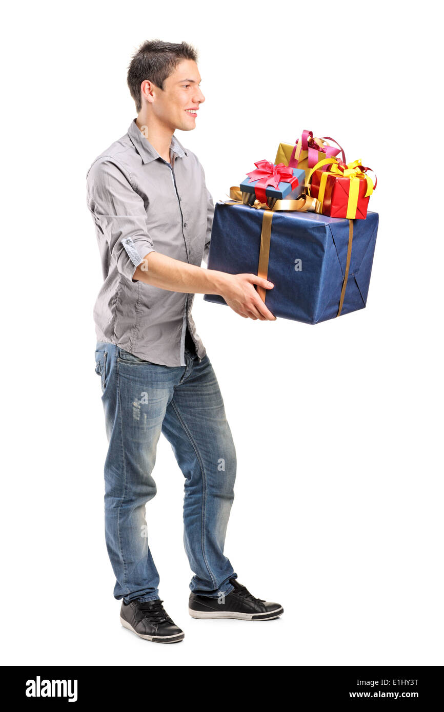 Full length portrait of a young man holding a bunch of presents Stock ...