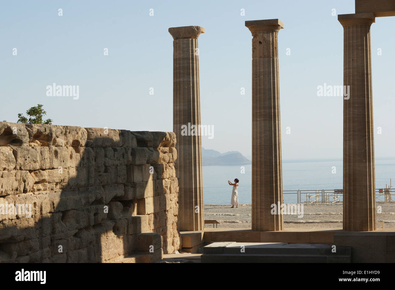 People exploring the Lindos Acropolis and taking in the views of the ...