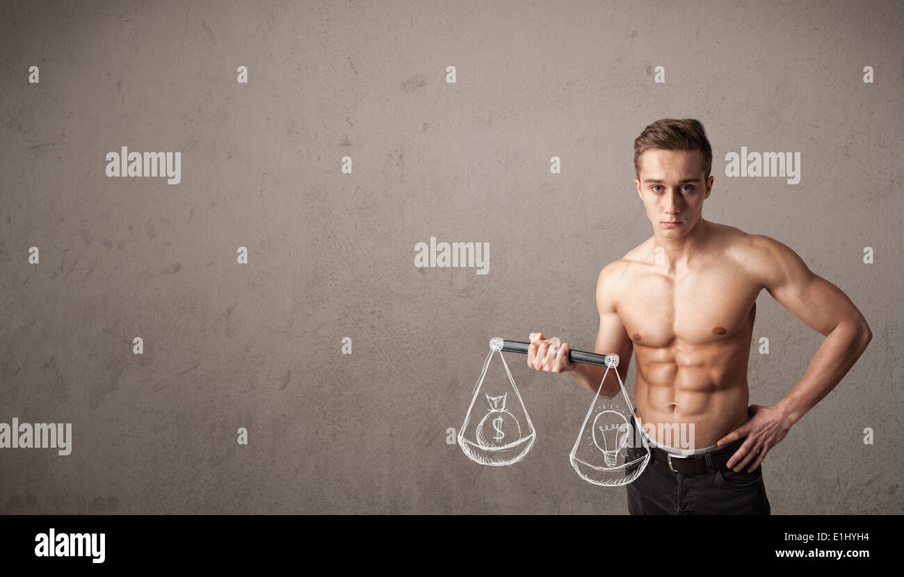 muscular man trying to get balanced Stock Photo - Alamy