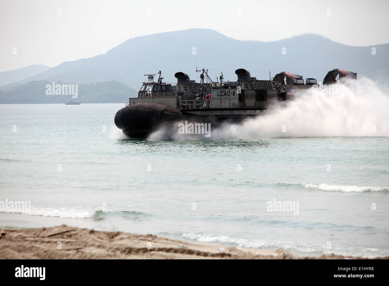 A U.S. Navy landing craft air cushion hovercraft transporting U.S ...