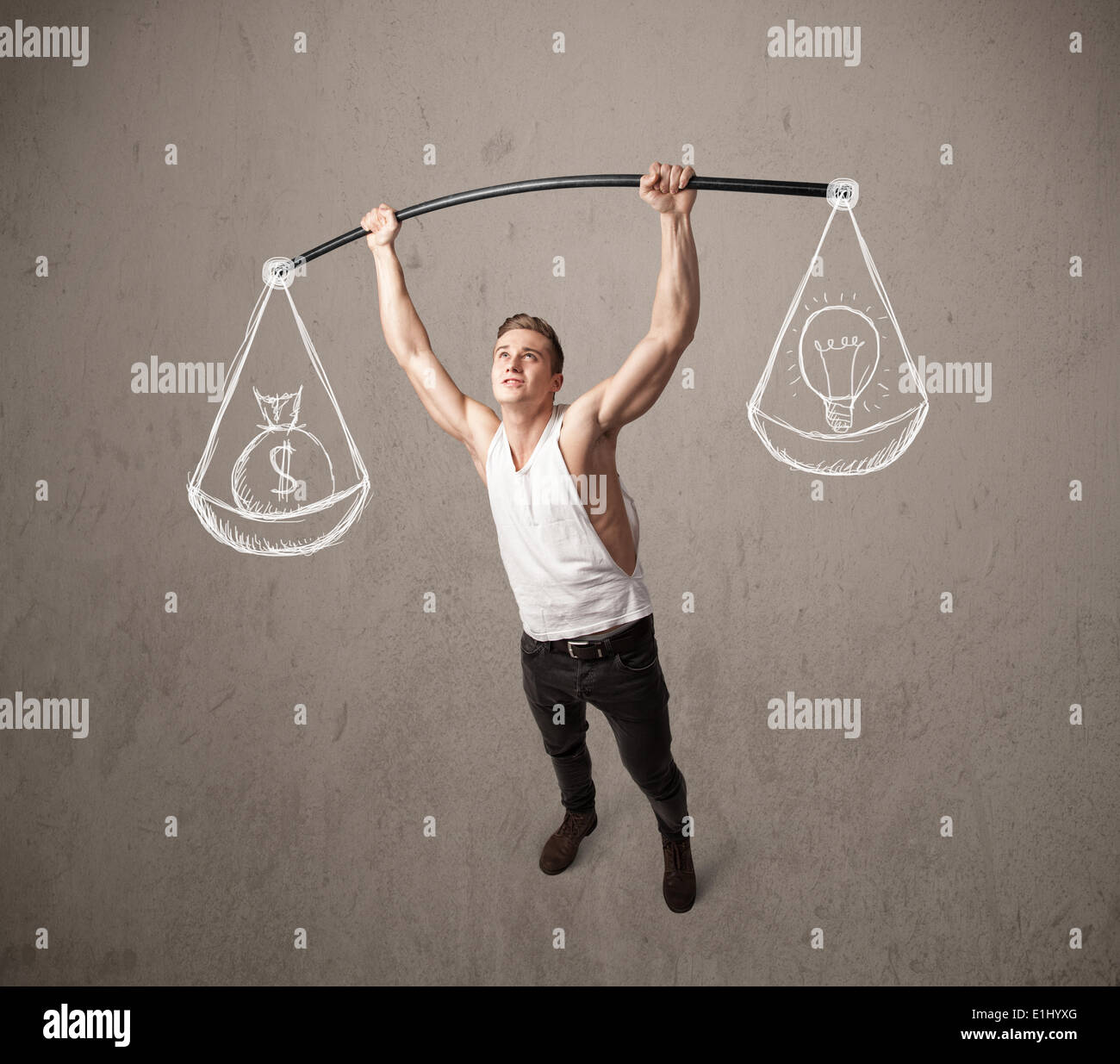 muscular man trying to get balanced Stock Photo - Alamy