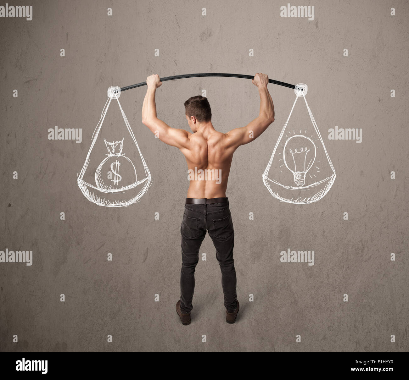muscular man trying to get balanced Stock Photo - Alamy