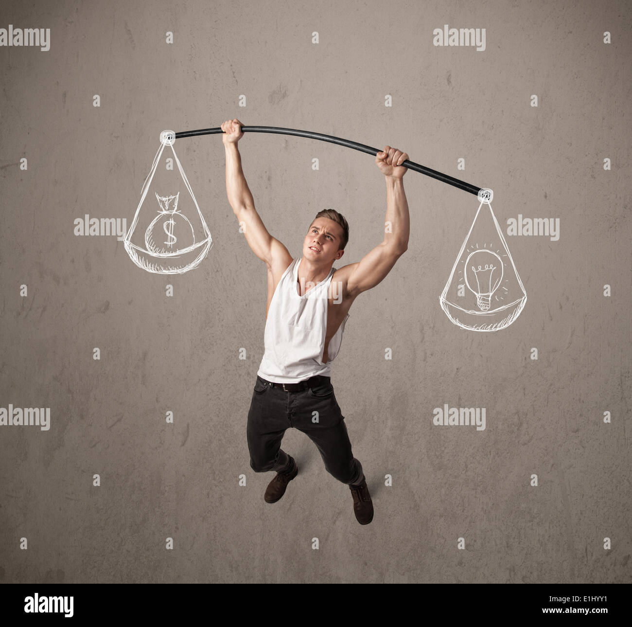 muscular man trying to get balanced Stock Photo - Alamy