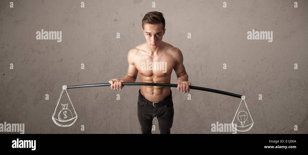 muscular man trying to get balanced Stock Photo - Alamy