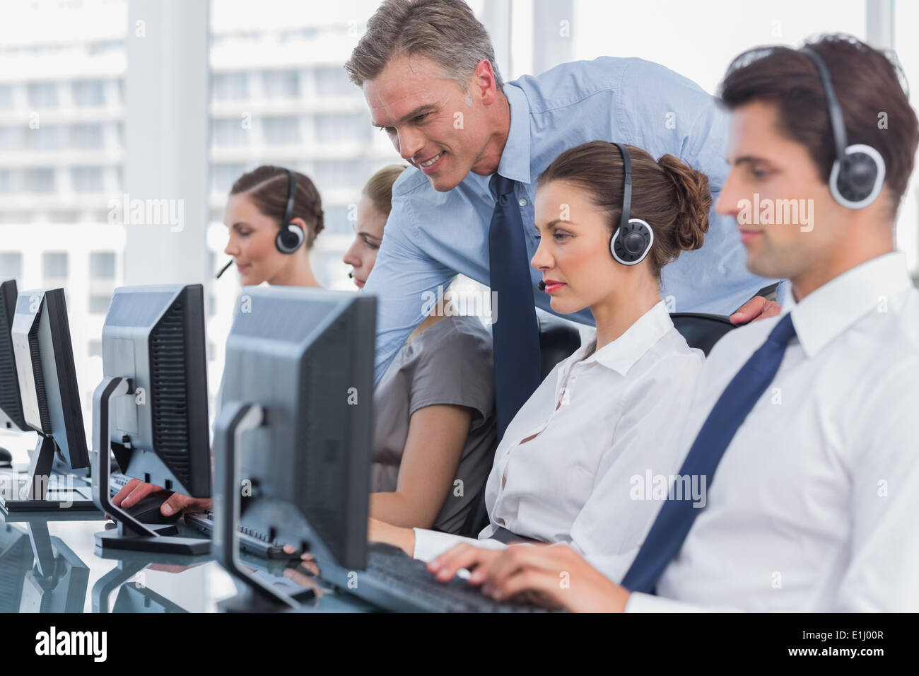 Male manager helping call center hi-res stock photography and images ...