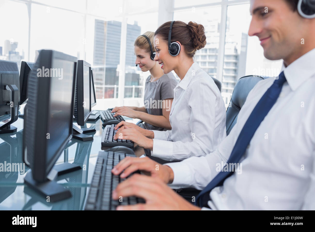 Male female call center agents hi-res stock photography and images - Alamy
