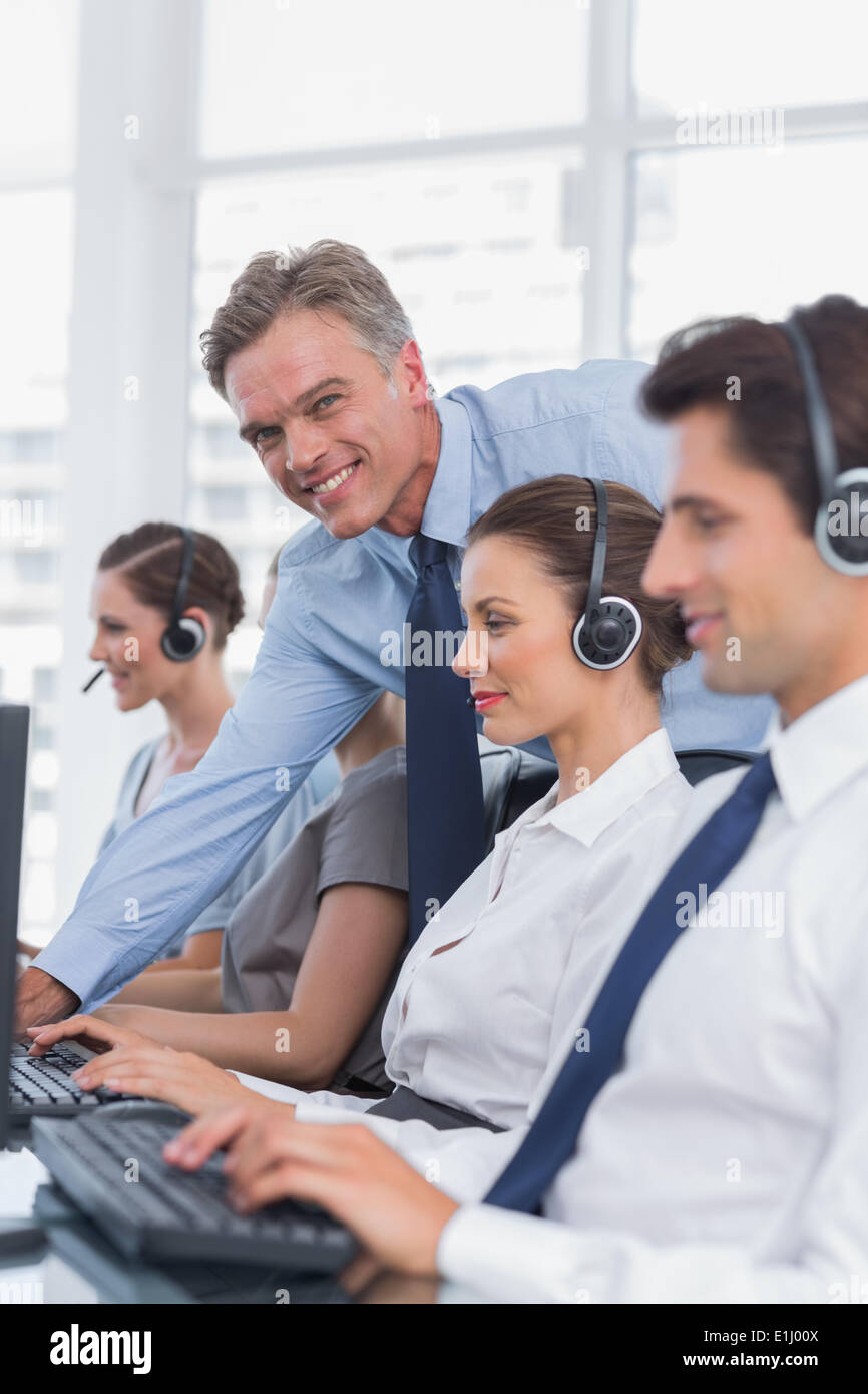 Call centre working with headset Stock Photo - Alamy