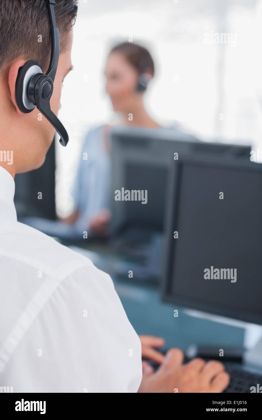 Business man working in a call centre Stock Photo - Alamy