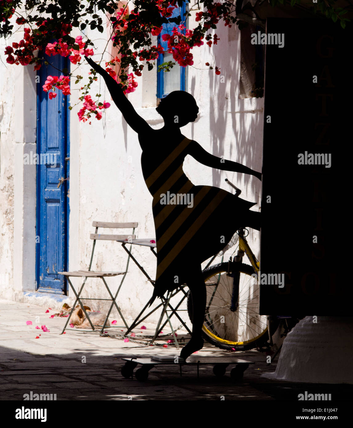Silhouette of shop sign 'dancer' in Kos Town side street Stock Photo ...