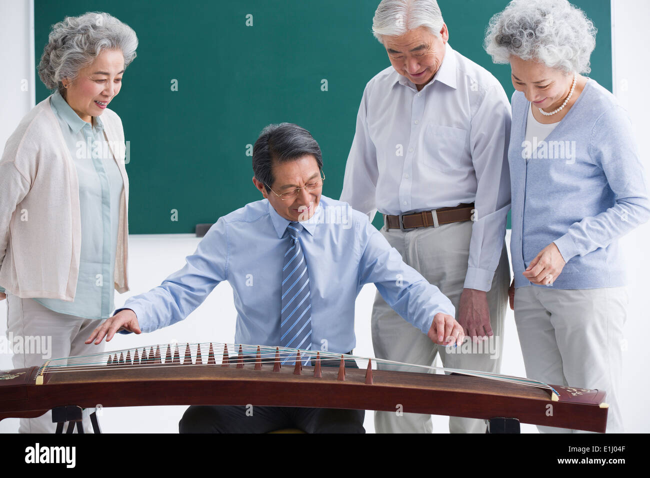 Senior adults having music class at school Stock Photo - Alamy