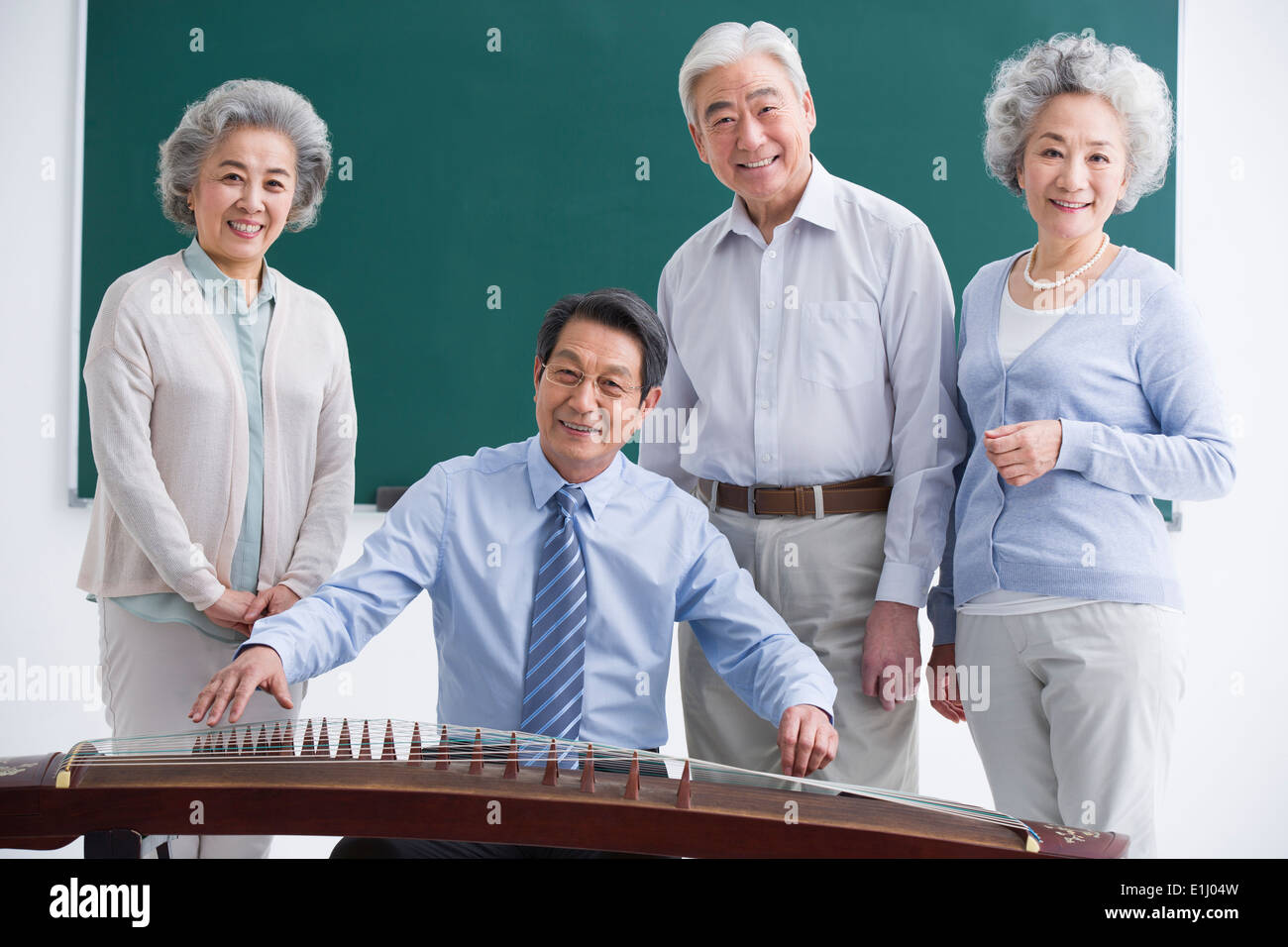 Senior adults having music class at school Stock Photo - Alamy