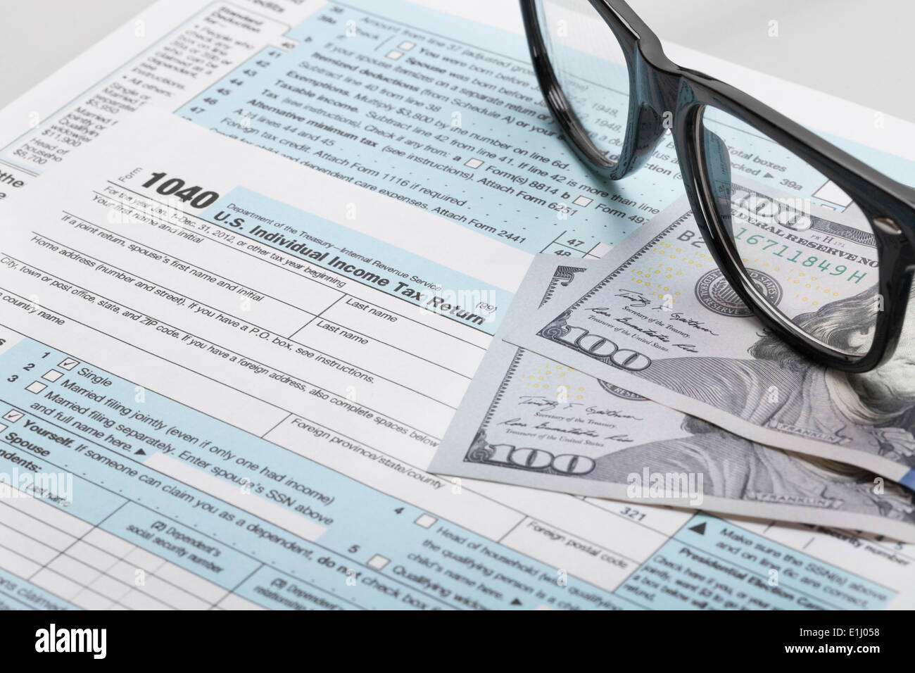 Tax Form 1040 with glasses Stock Photo - Alamy
