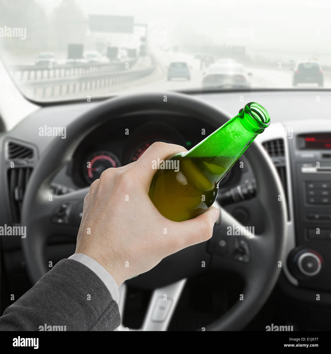Man with bottle of beer while driving car - 1 to 1 ratio Stock Photo ...