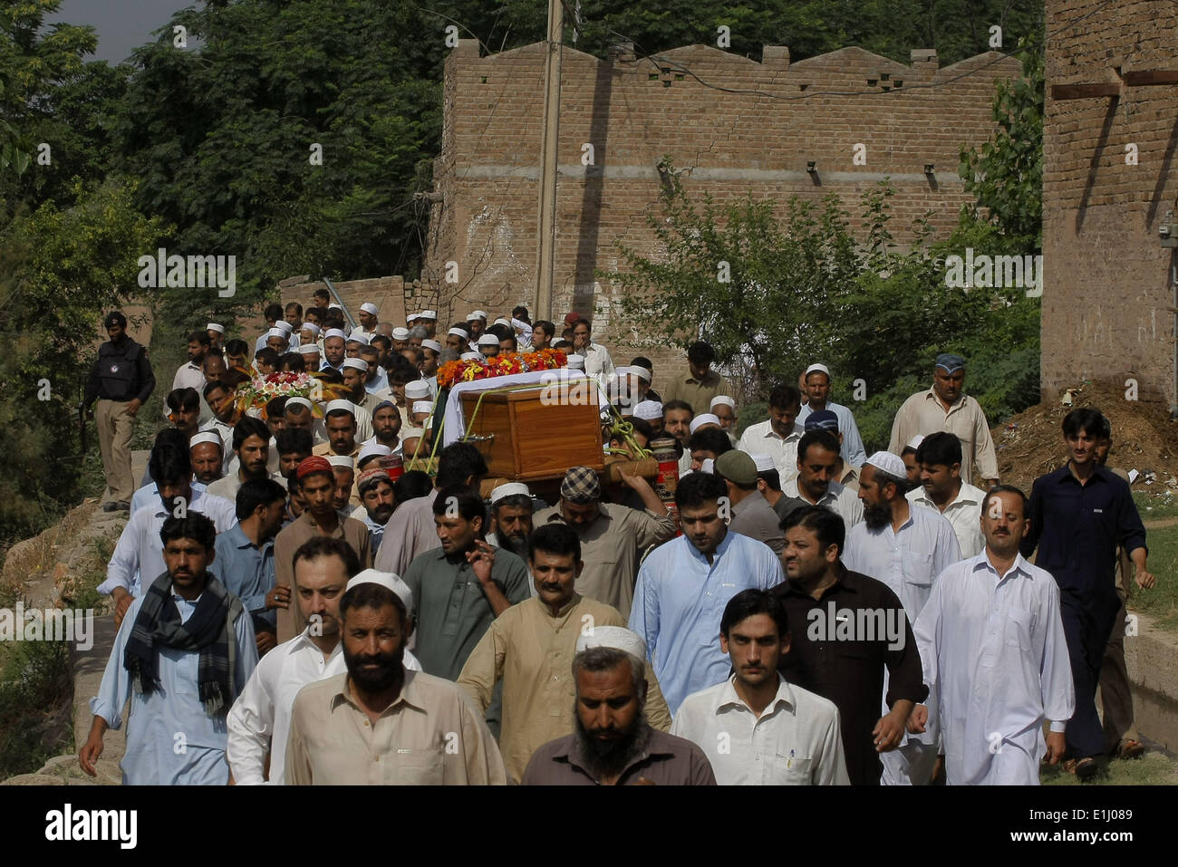 Relatives attend funeral ceremony hi-res stock photography and images ...