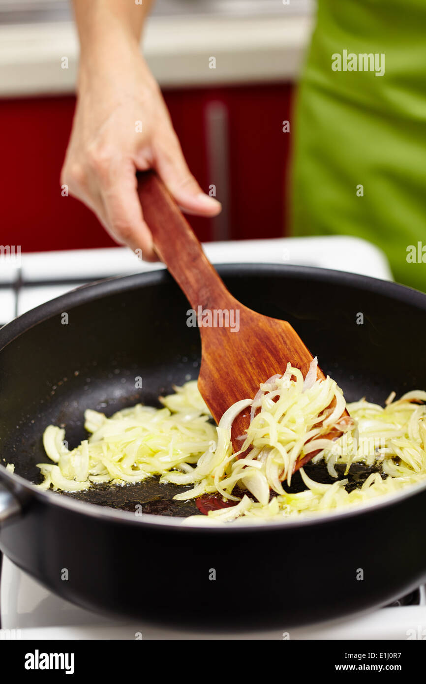 Person stirring food in pan hi-res stock photography and images - Alamy