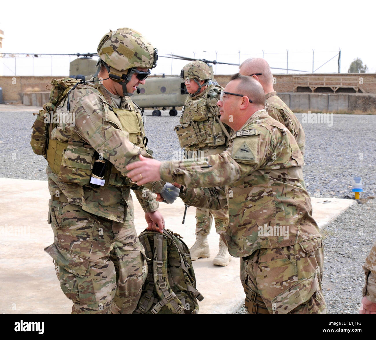 U.S. Army Command Sgt. Maj. Russel Reimers, right, the senior enlisted ...