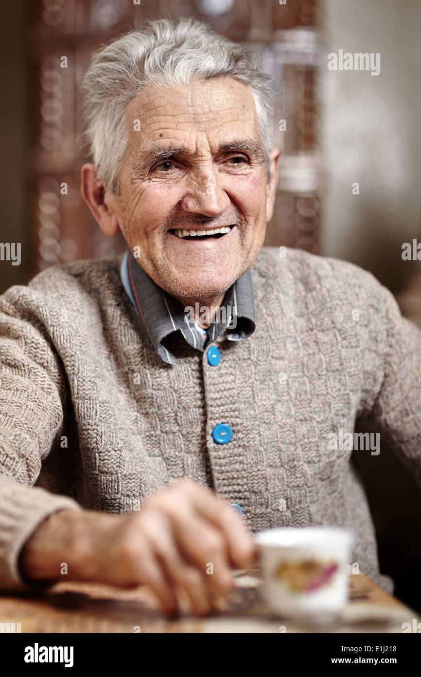 Happy old man indoor having his morning cup of coffee Stock Photo - Alamy