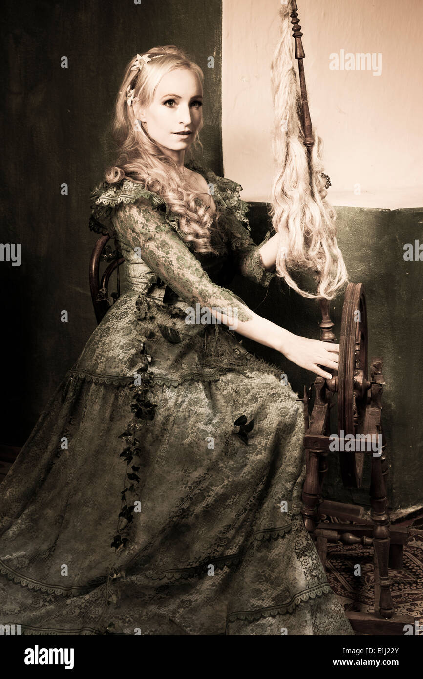 Woman sitting at spinning wheel hi-res stock photography and images - Alamy