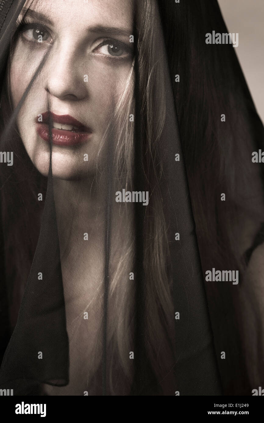 Portrait of young woman wearing mourning veil Stock Photo - Alamy