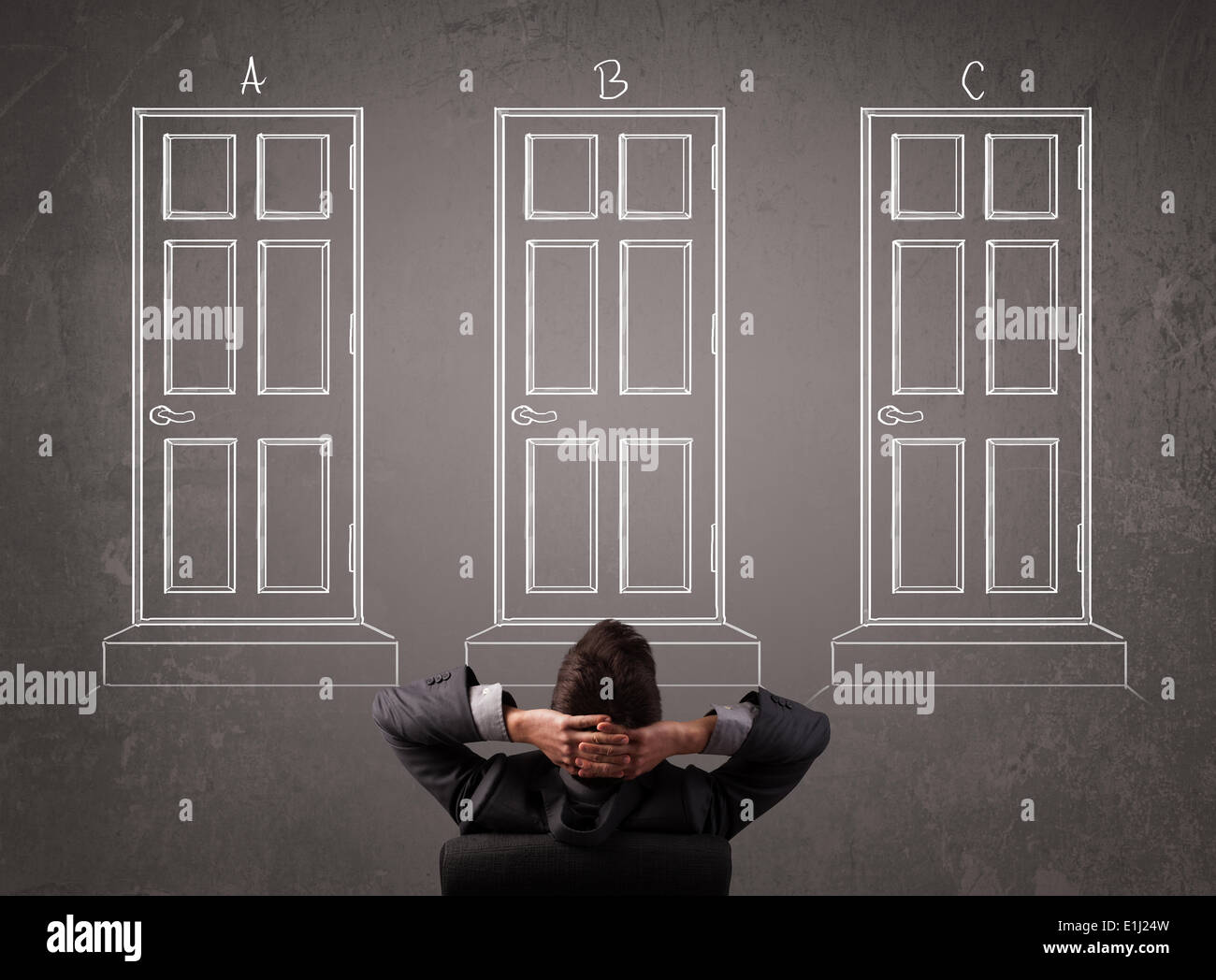 Businessman choosing the right door Stock Photo - Alamy