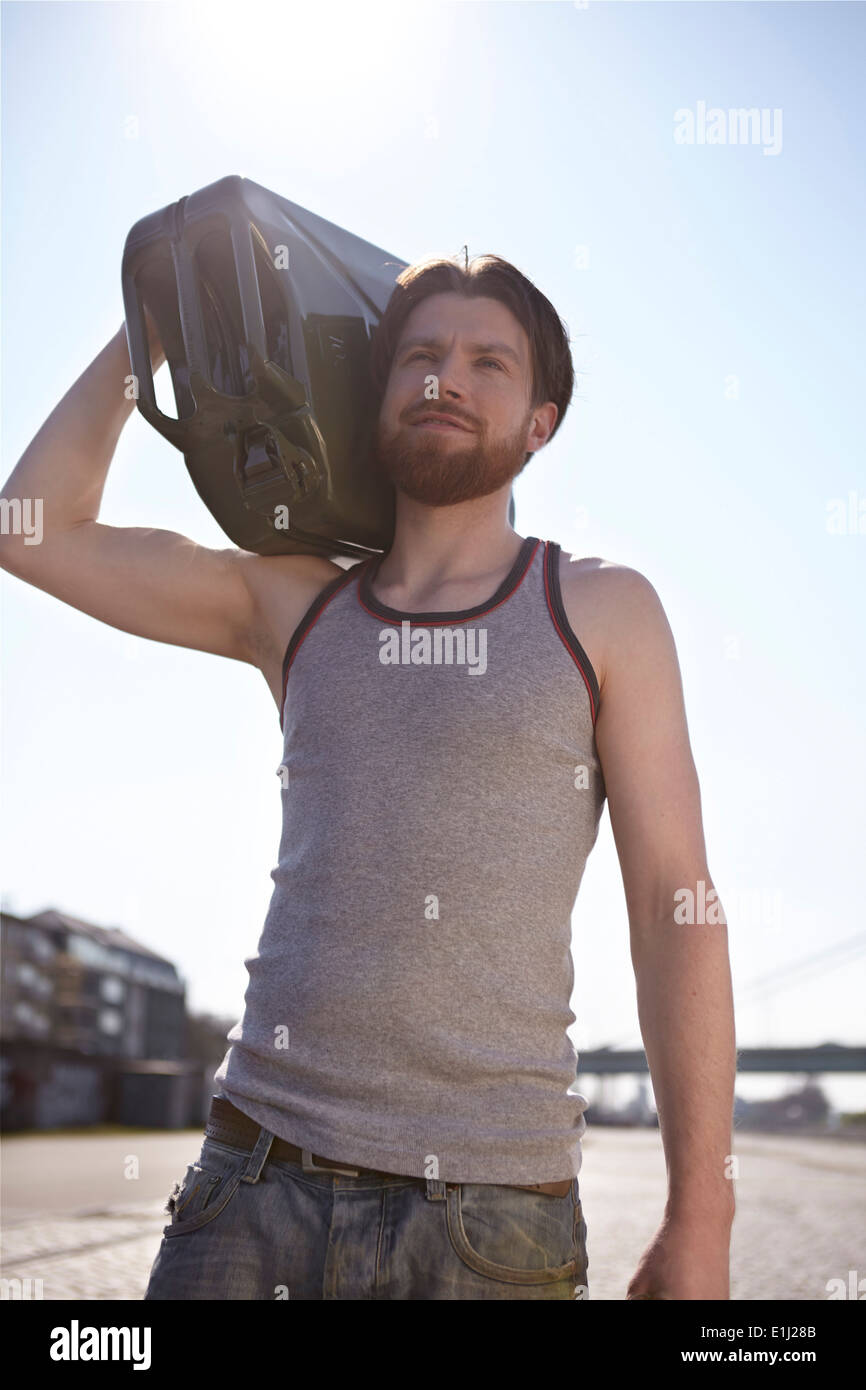Man carrying petrol can hi-res stock photography and images - Alamy