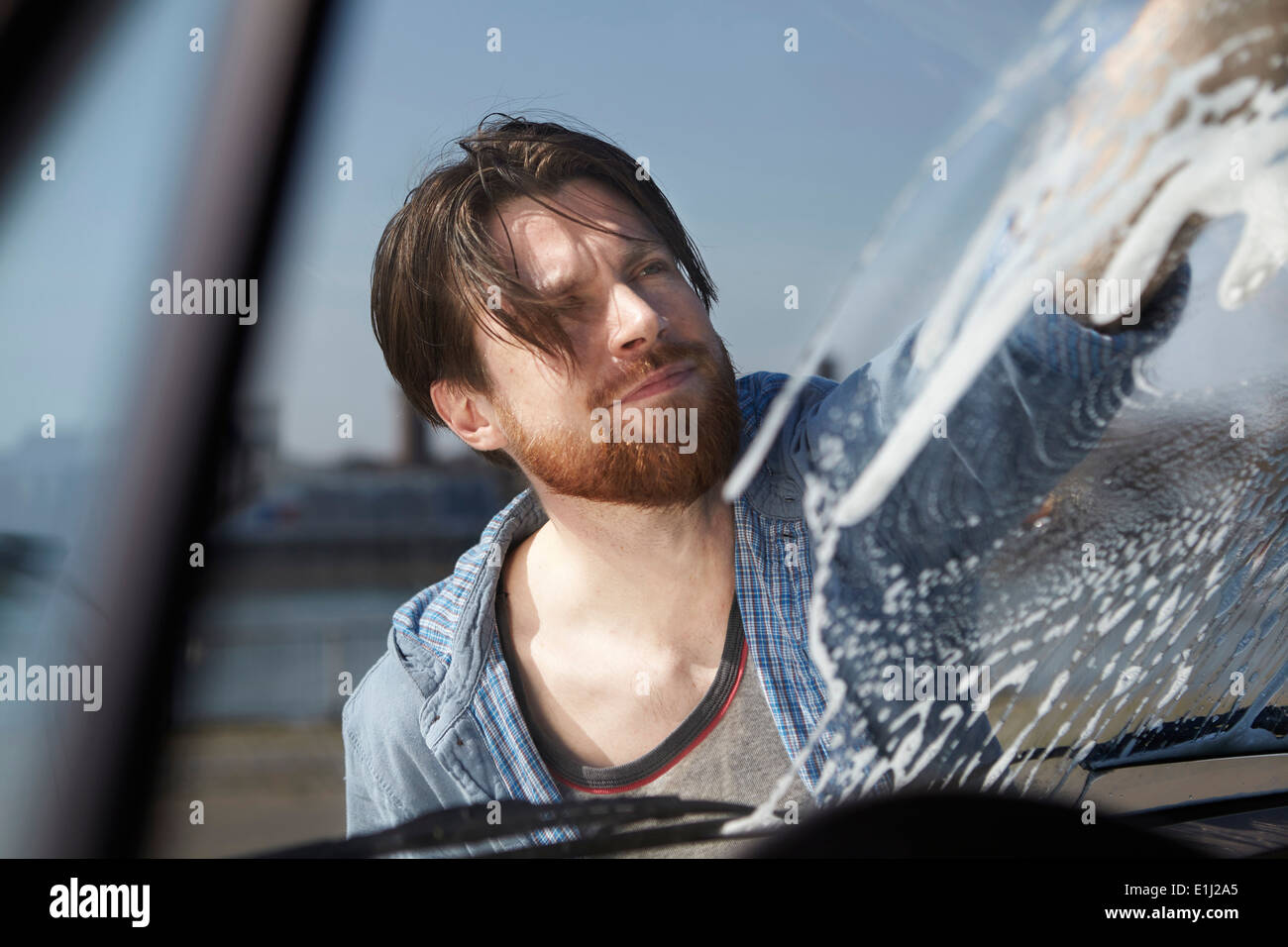 Man washing front window of a car Stock Photo - Alamy