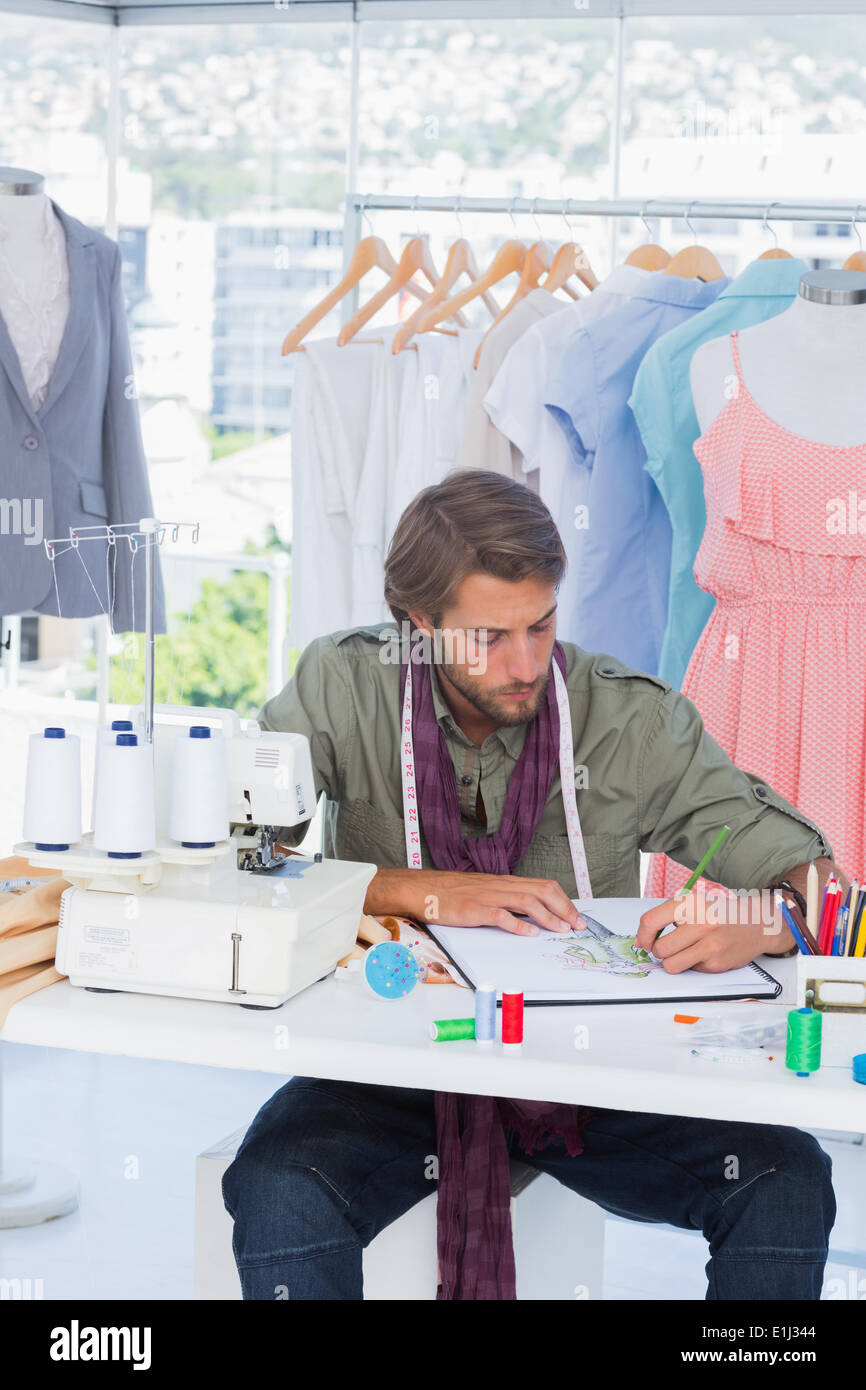 Fashion designer drawing clothes Stock Photo - Alamy