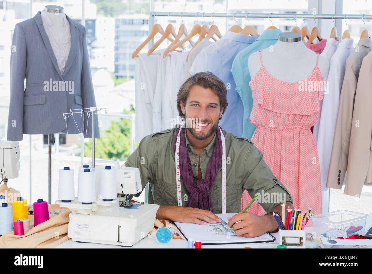 Attractive fashion designer sketching design hi-res stock photography ...