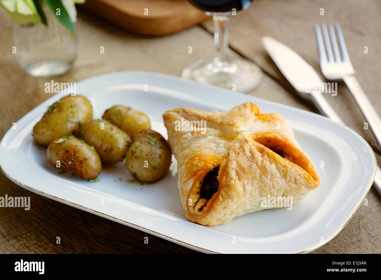 Puff pastry parcels with a chestnut mushroom filling and potatoes Stock ...