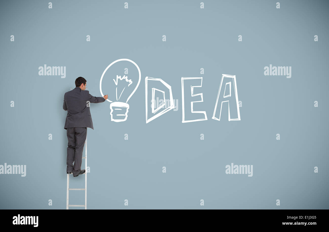 Buisnessman on ladder writing idea Stock Photo - Alamy