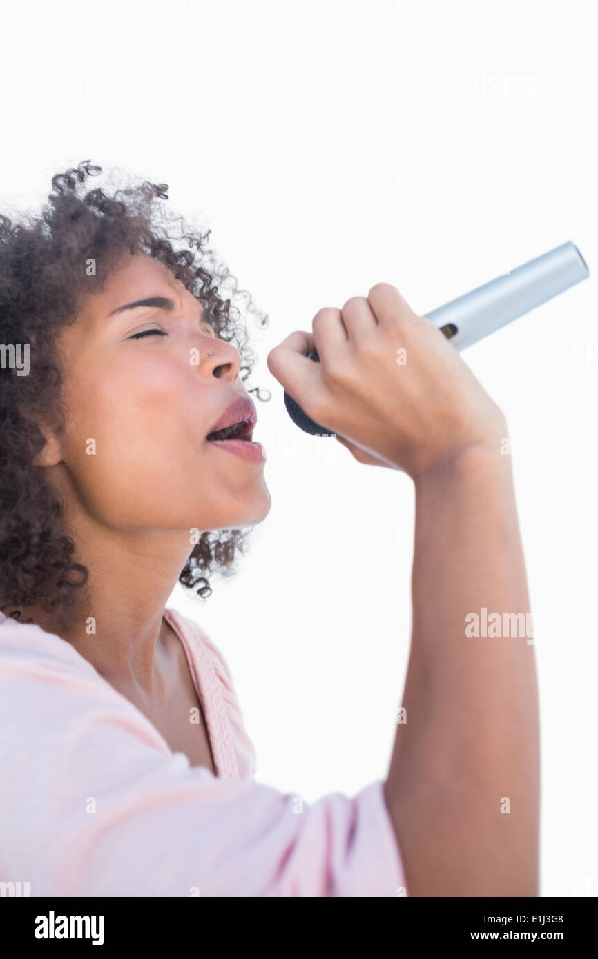 Pretty woman singing at karaoke Stock Photo - Alamy
