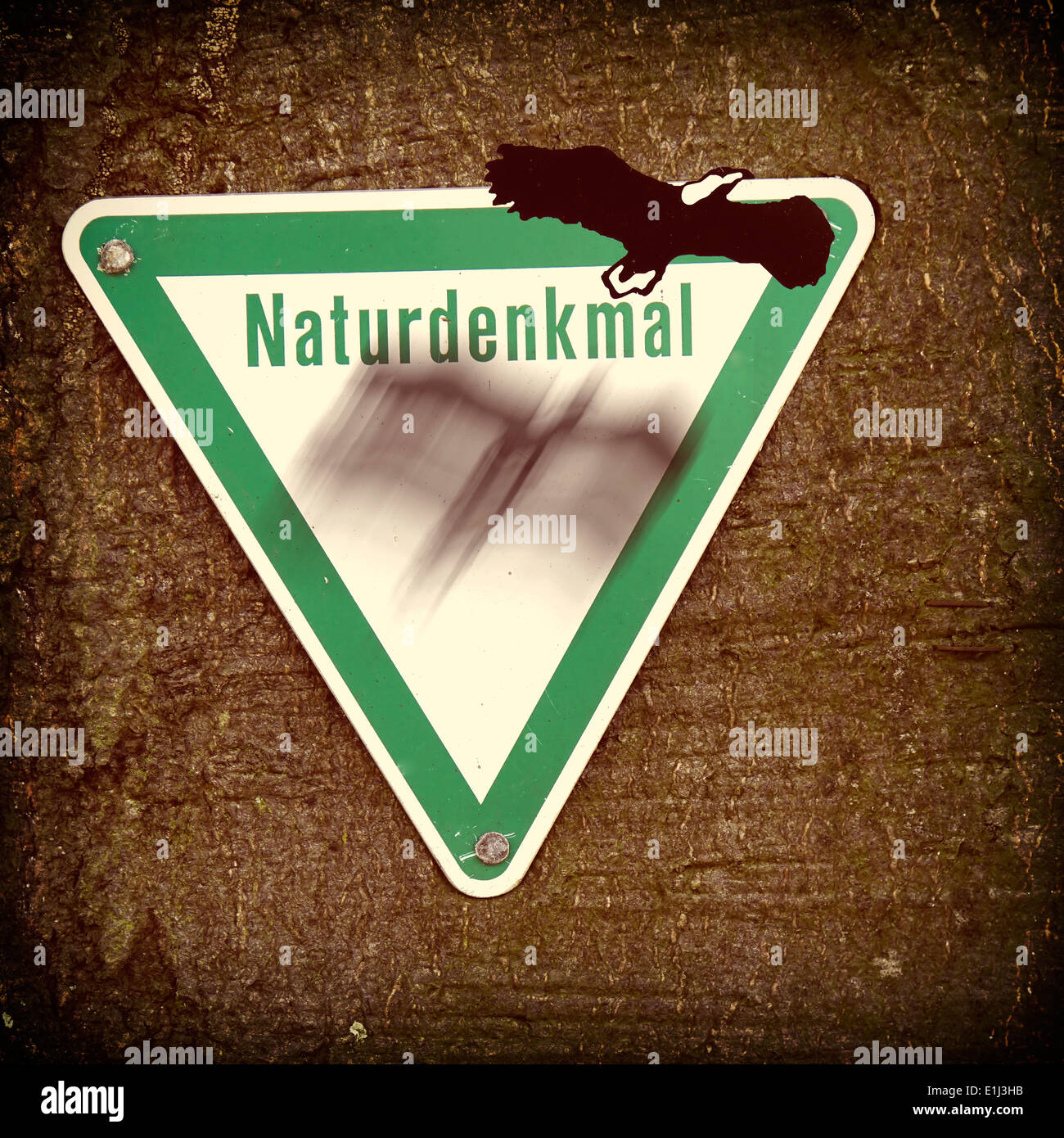 Sign with flying eagle, composite Stock Photo - Alamy