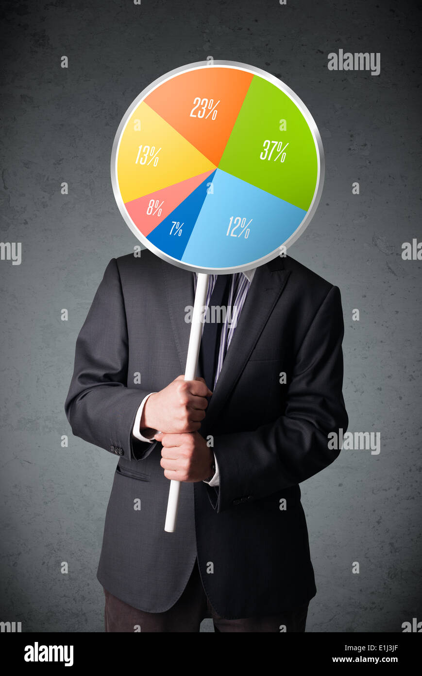 Businessman holding a pie chart Stock Photo - Alamy