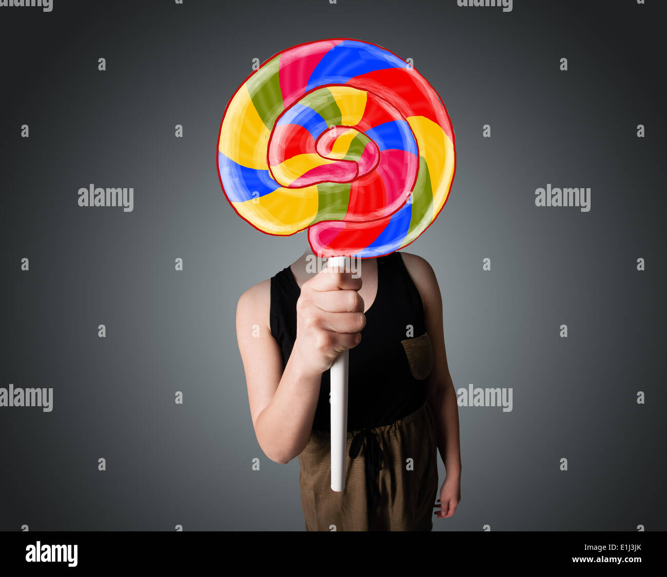 Young woman holding a lollipop Stock Photo - Alamy
