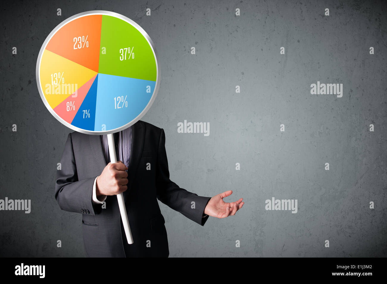 Businessman holding a pie chart Stock Photo - Alamy