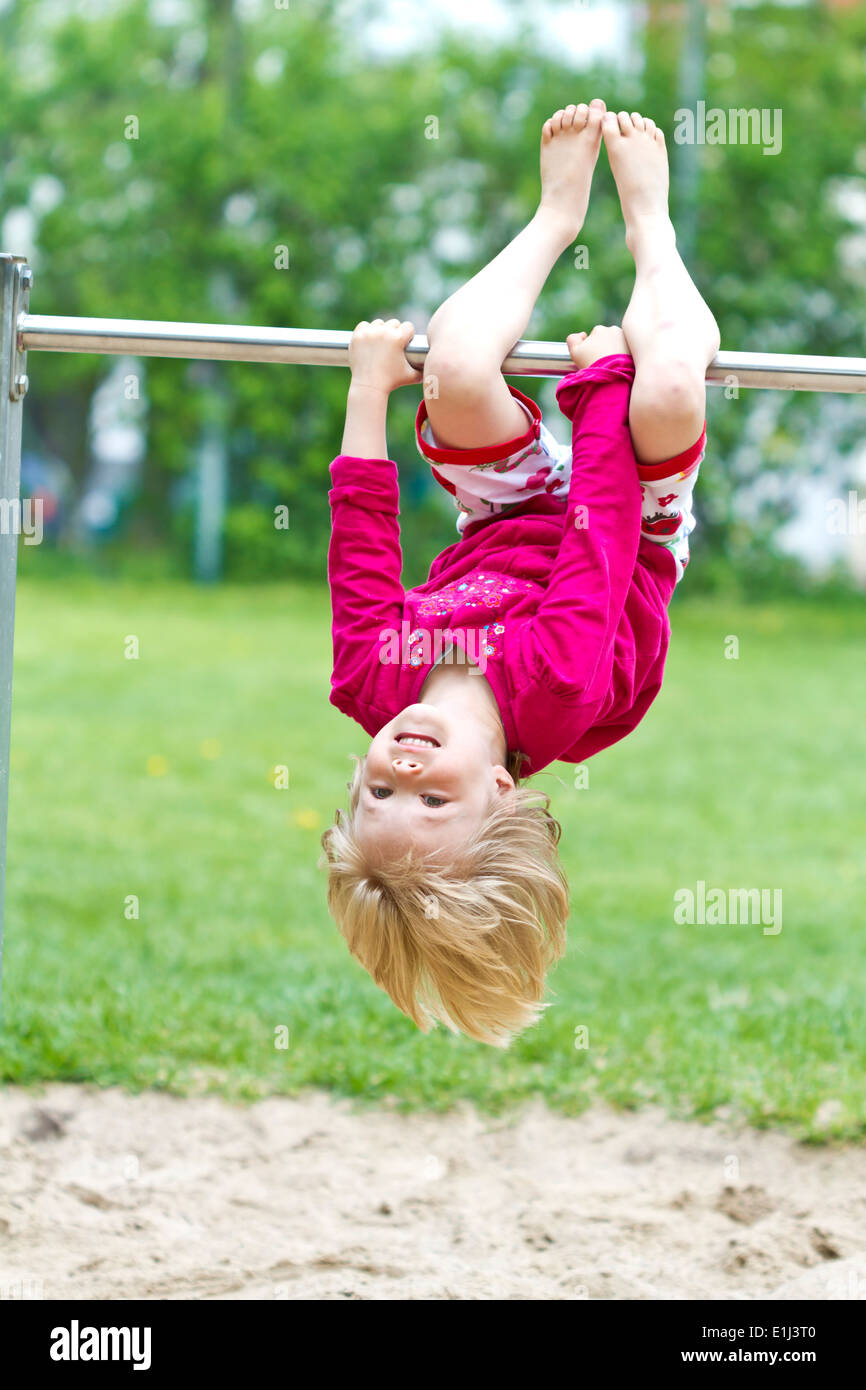 Child hanging playground full length hi-res stock photography and ...